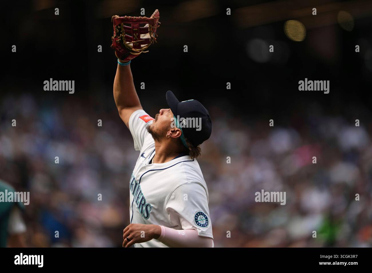 Seattle Mariners first baseman Josh Naylor makes a catch on a pop fly ...