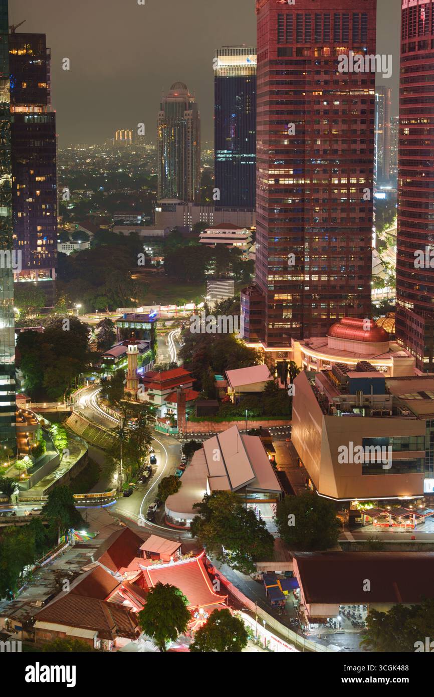 Long exposure night view of Jakarta cityscape with illuminated towers ...