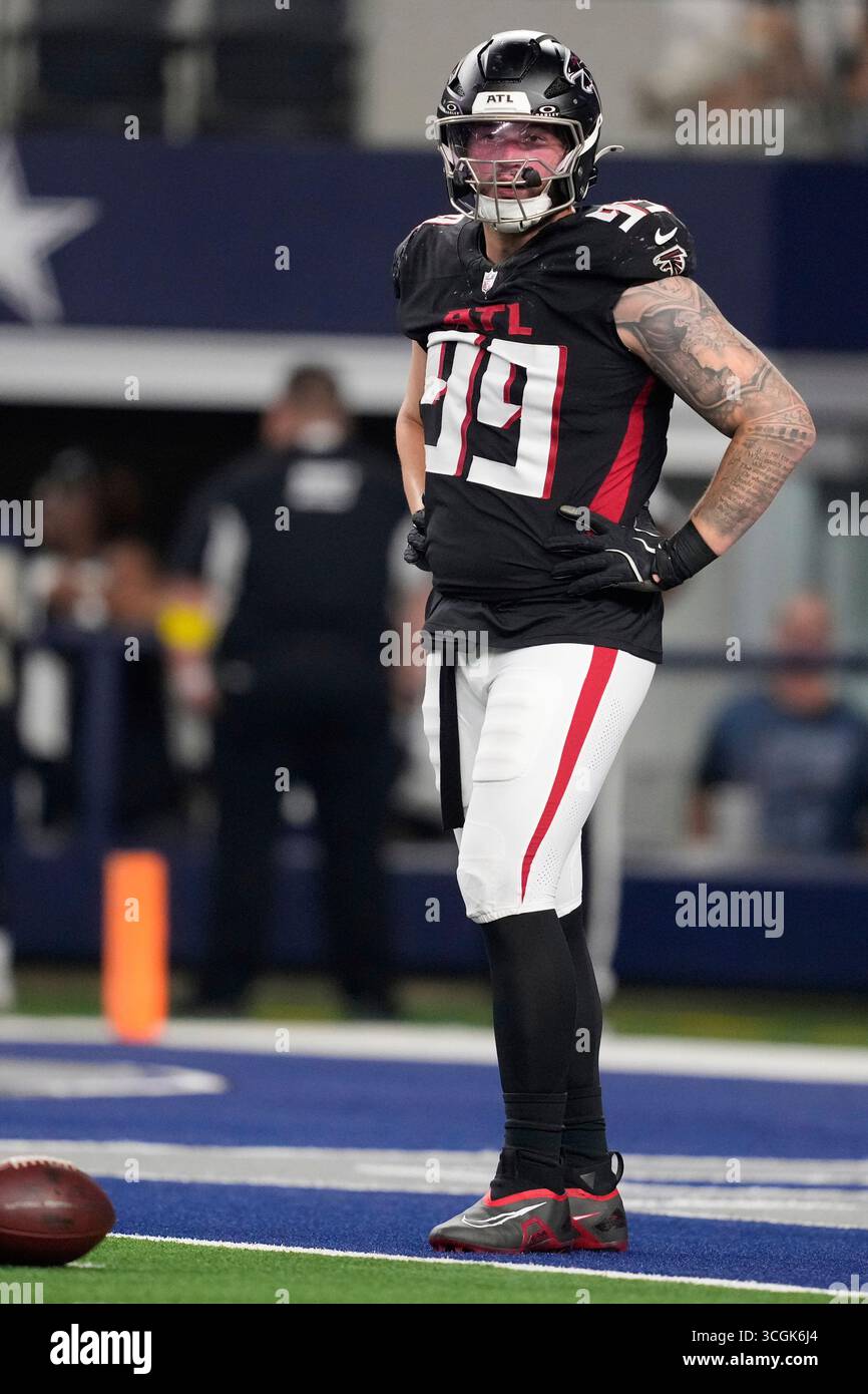Atlanta Falcons defensive end Morgan Fox (99) lines up against the ...