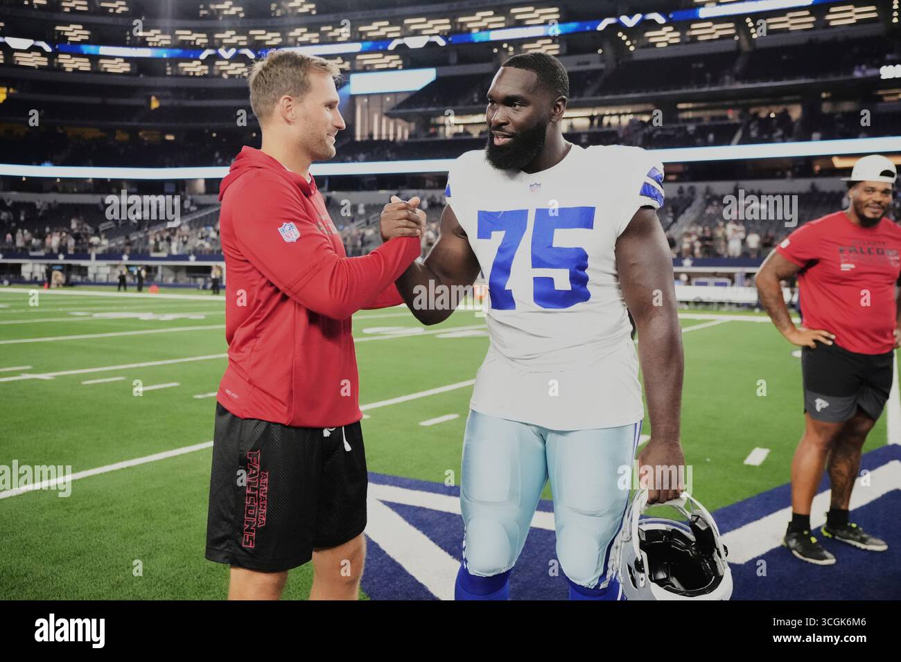 Atlanta Falcons quarterback Kirk Cousins, left, greets Dallas Cowboys ...