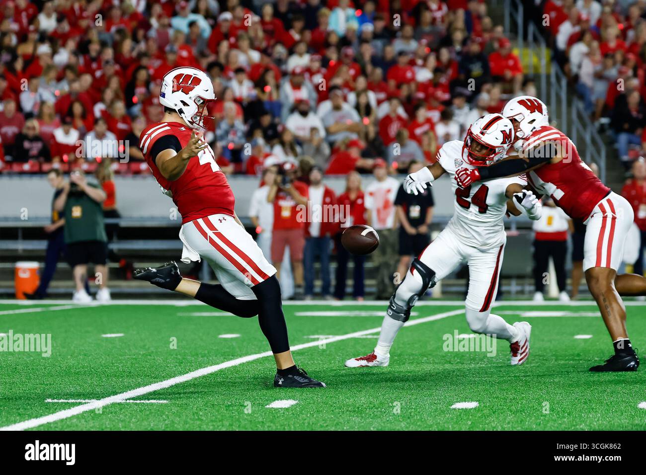 August 28, 2025: Wisconsin Badgers punter Atticus Bertrams (49) punts ...