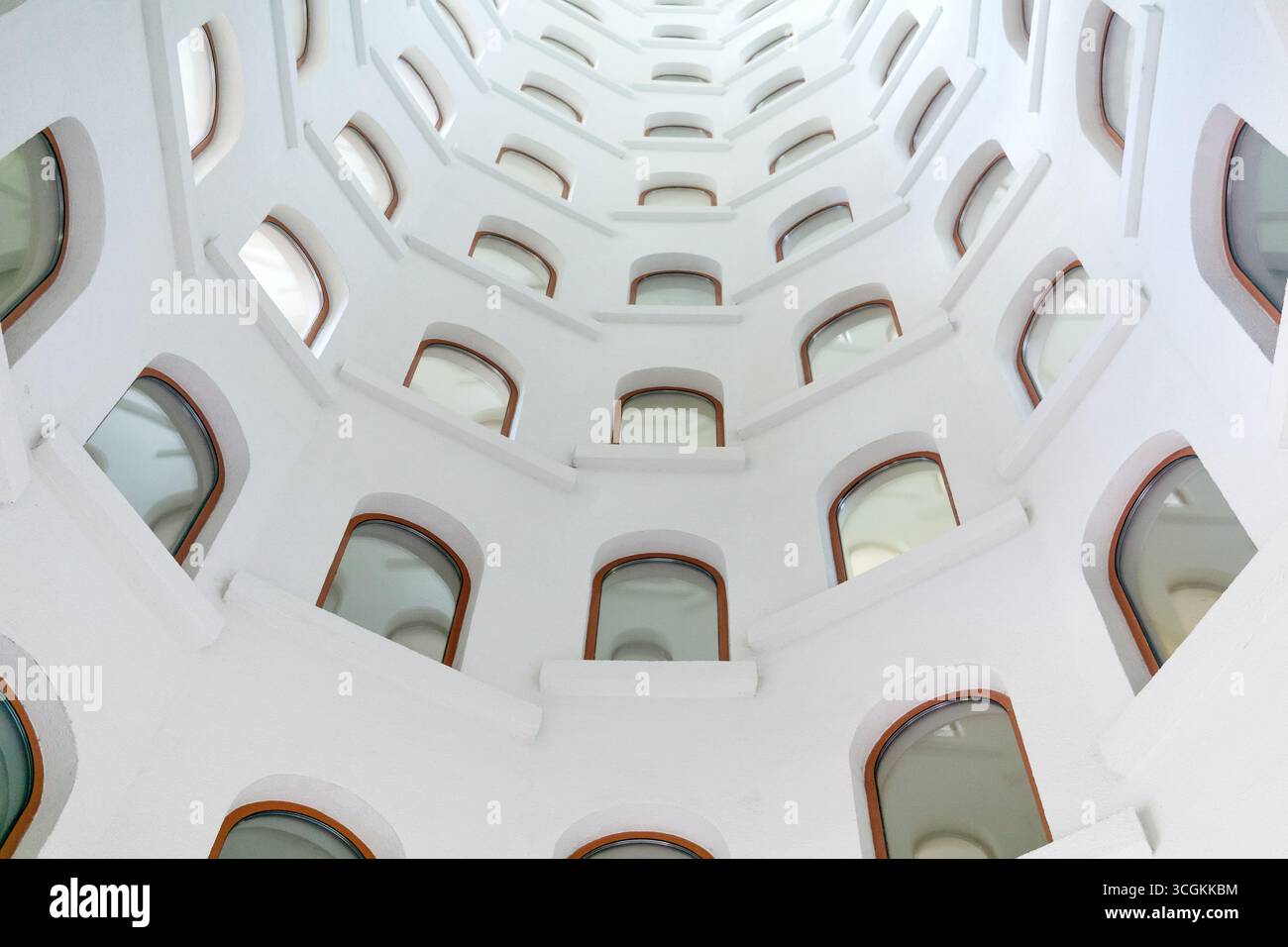 architectural background, spiral staircase with windows opening into a ...