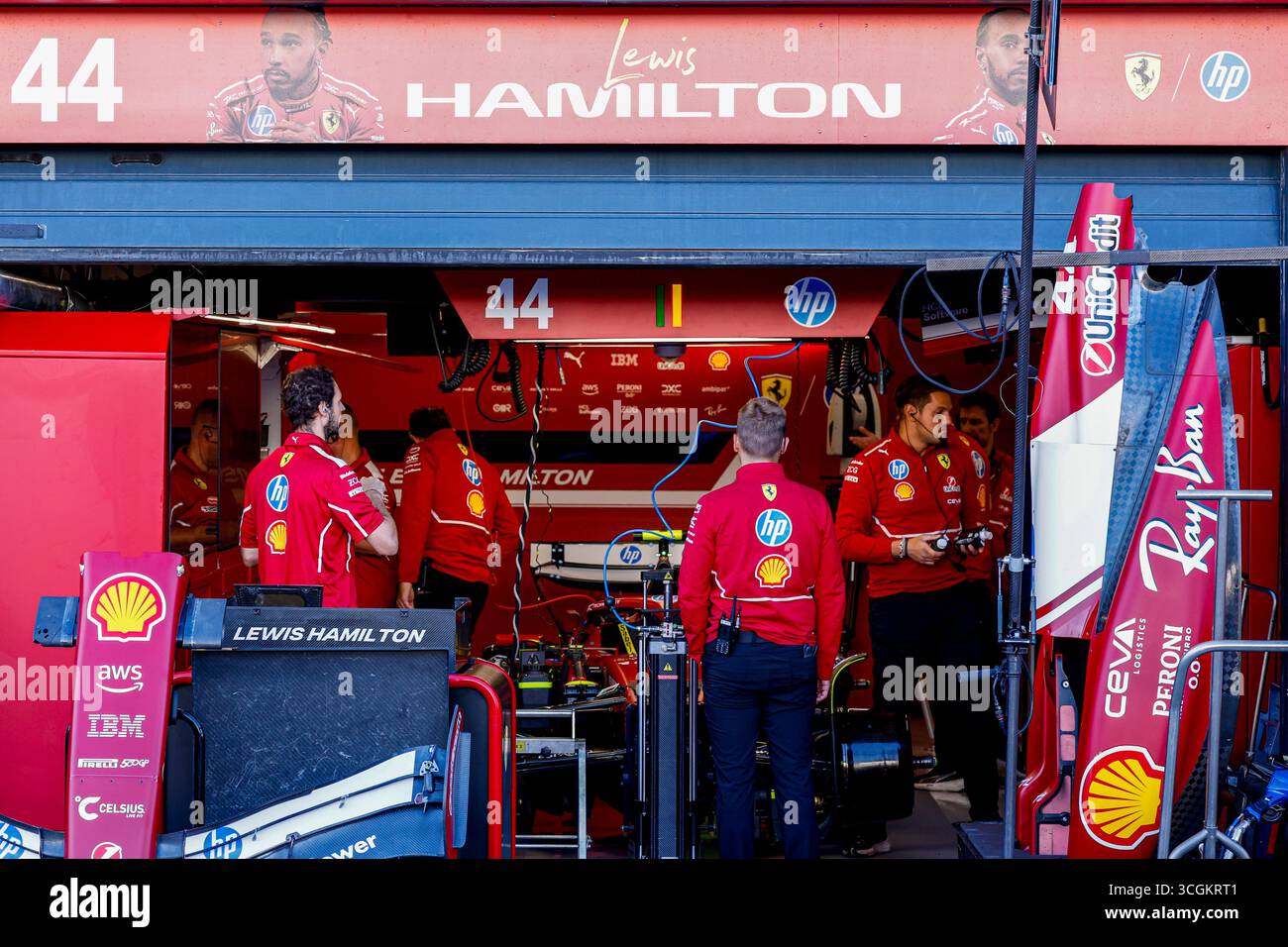Scuderia Ferrari mechanics working on the car of Lewis Hamilton in the pit box during the ...