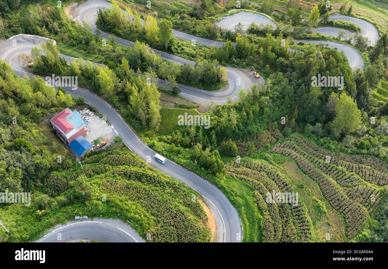 Aerial photo shows the winding mountain road in Youyang County ...