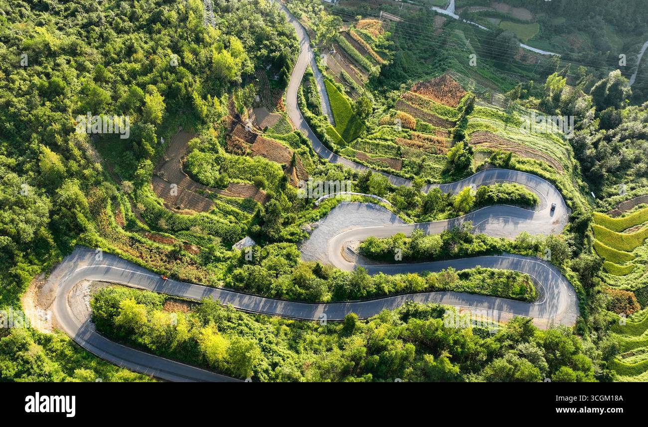Aerial photo shows the winding mountain road in Youyang County ...