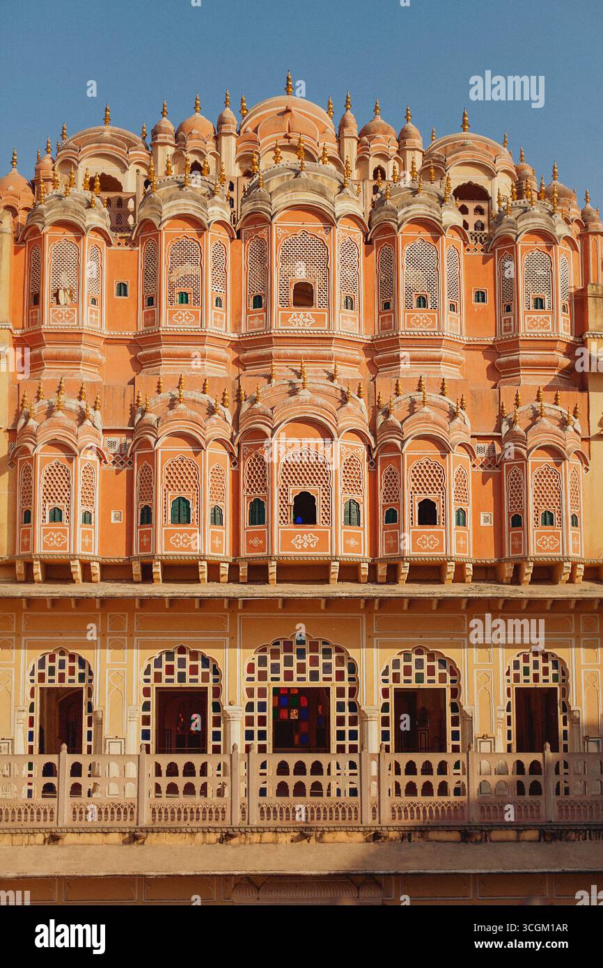 Windows and balconies on the pink and yellow facade of Hawa Mahal, also ...
