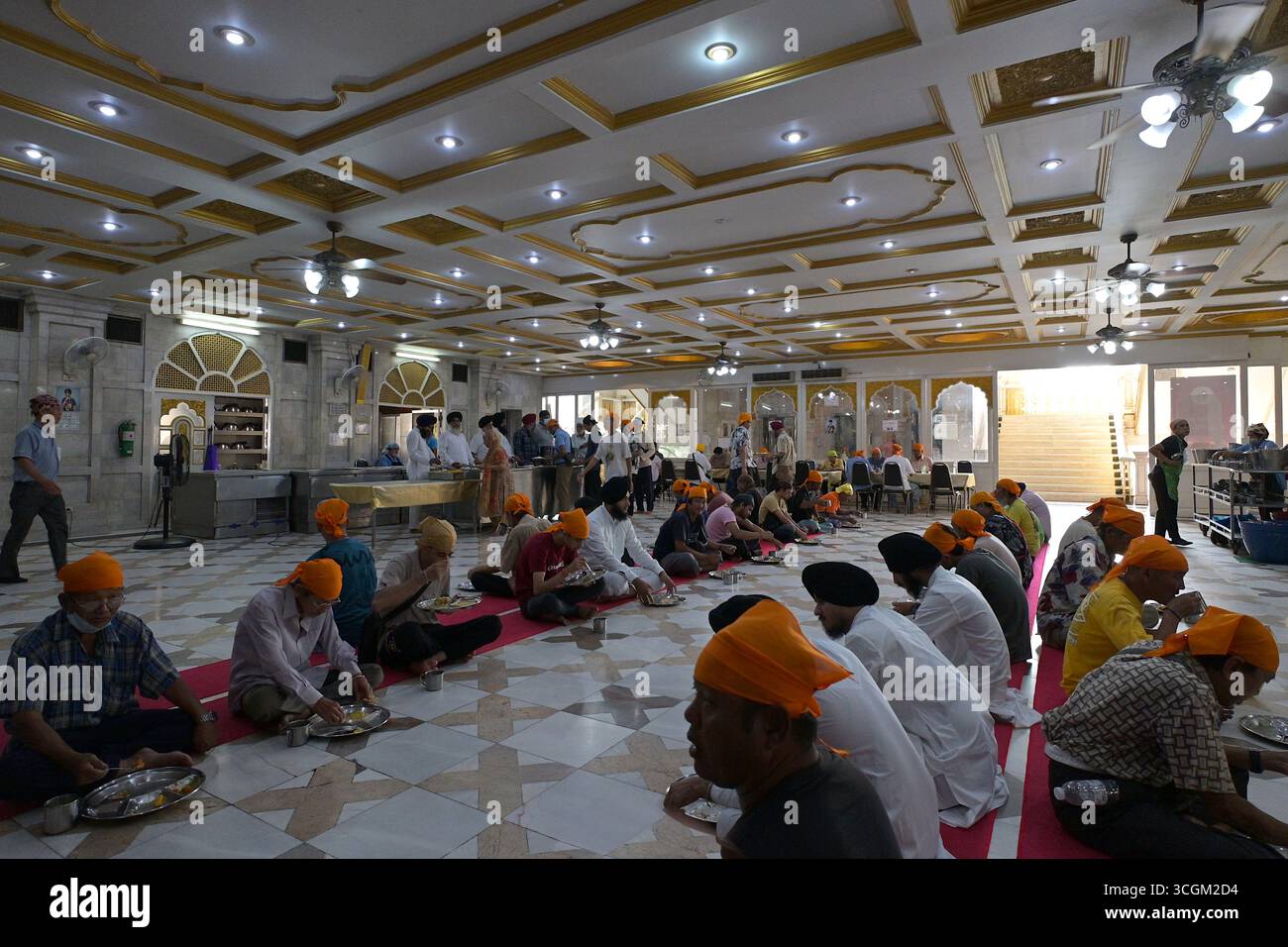 A morning meal in progress at the langar or community kitchen of Sri ...