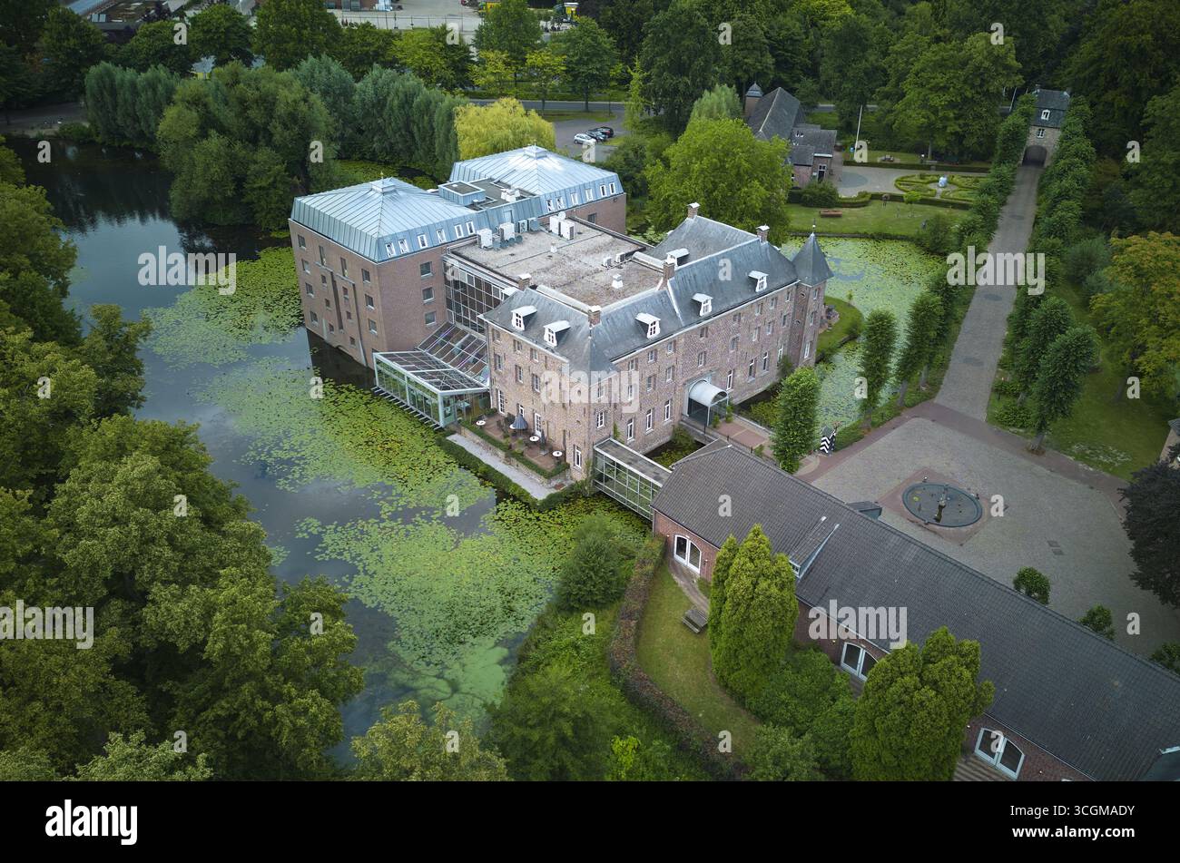 Aerial view of the stately castle surrounded by a moat reflecting the ...