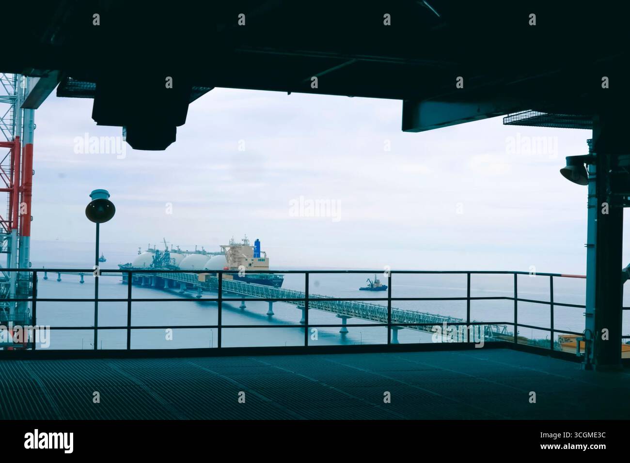 LNG tanker in port near the fueling terminal, view from the port deck ...