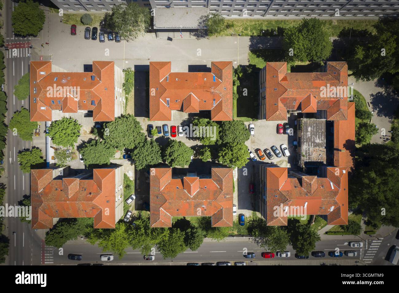 Aerial view of symmetrical buildings with terracotta roofs and ...
