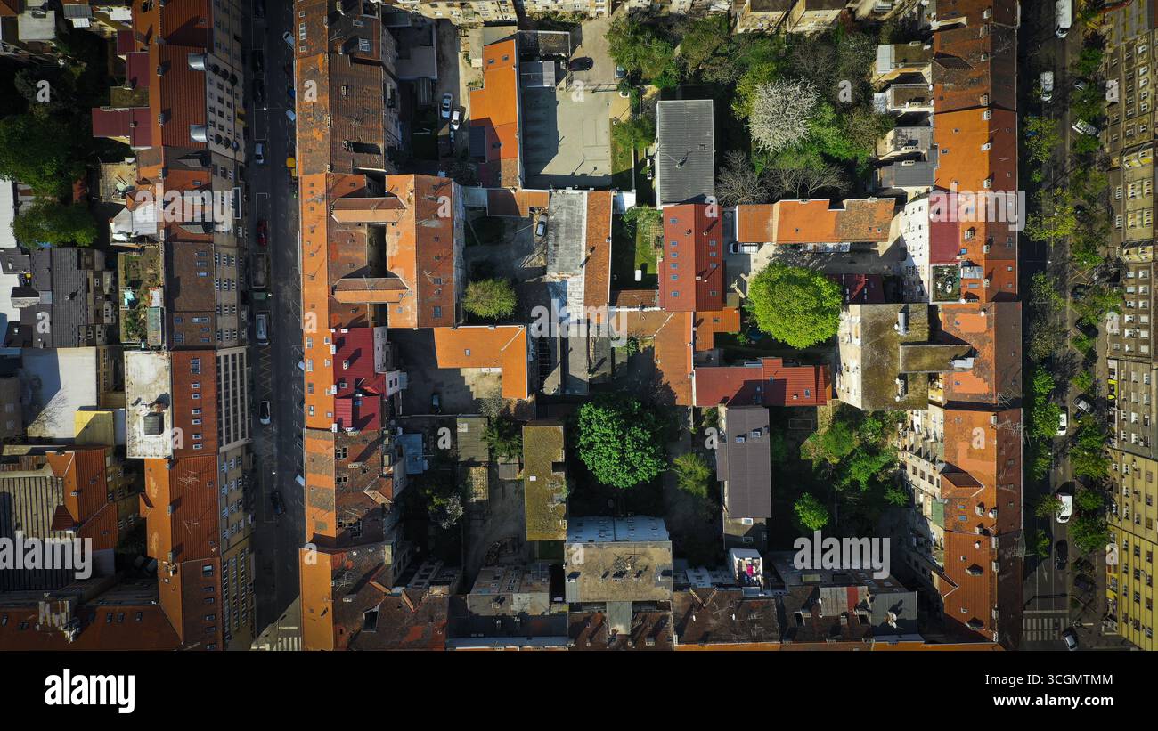 Aerial view of the city's rooftops, a dense patchwork of terracotta ...