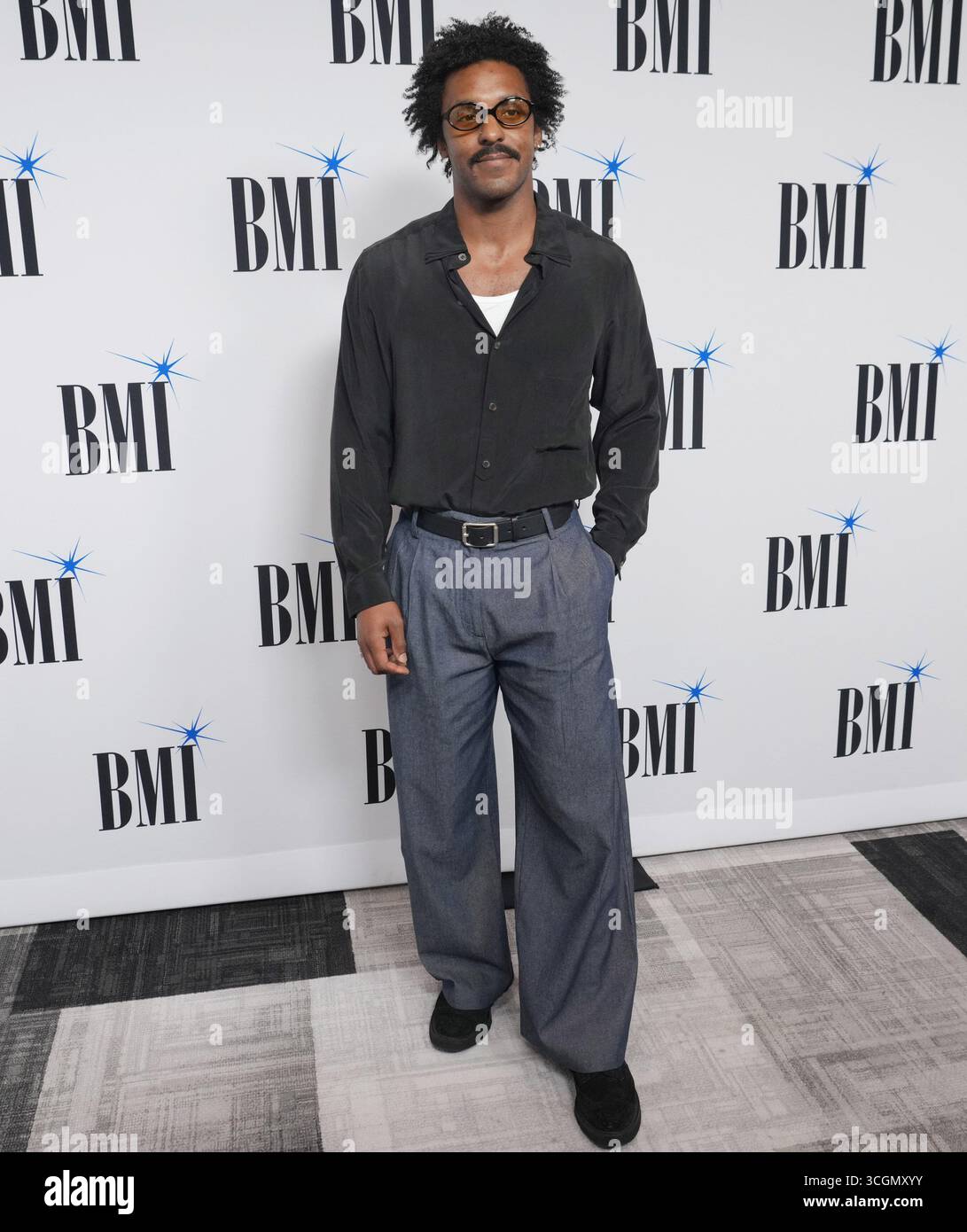 John Christo Welch arrives at the 2025 BMI R&B/Hip-Hop Awards held at ...