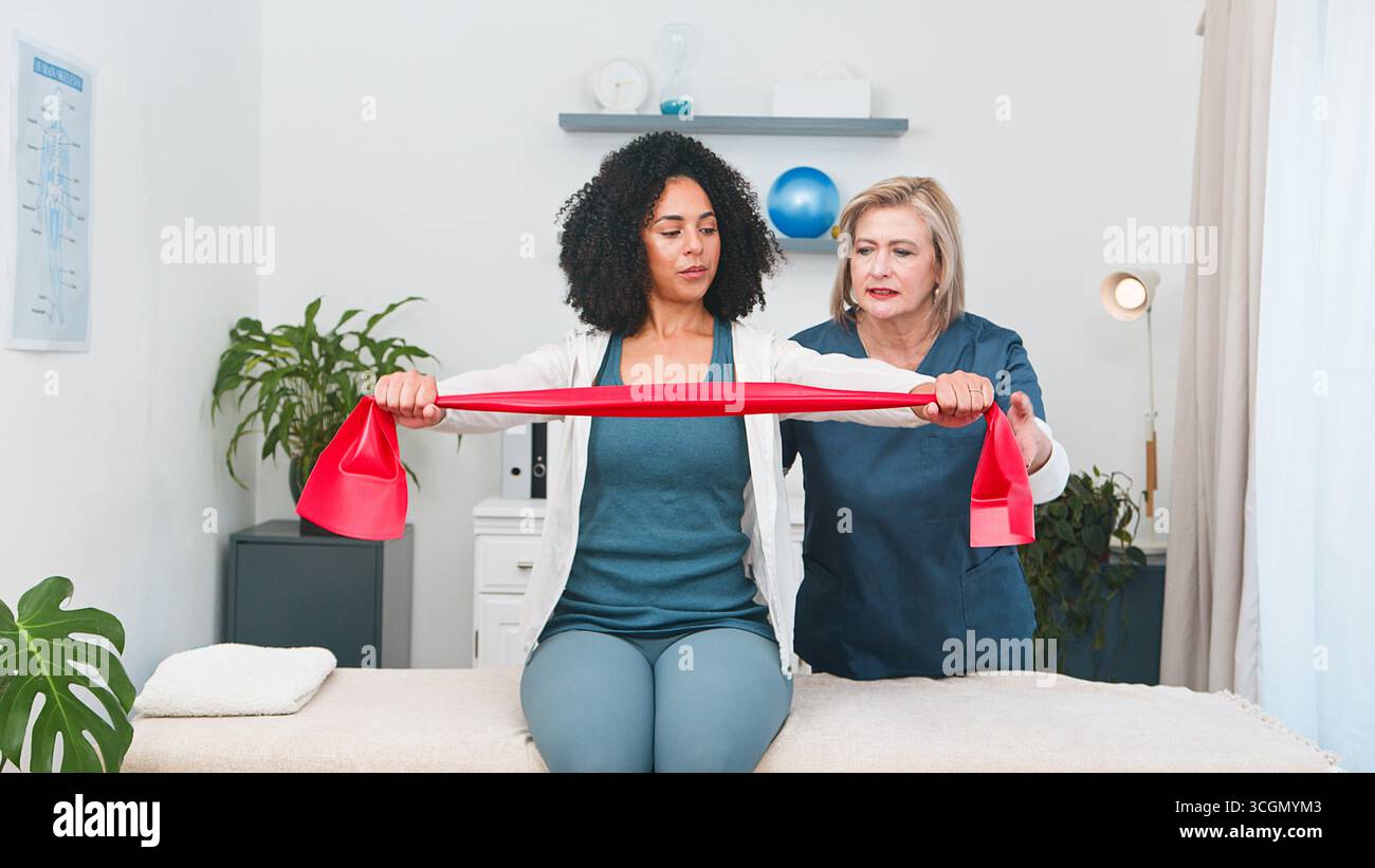 Senior Physiotherapist Guides Young Black Client Through Resistance ...