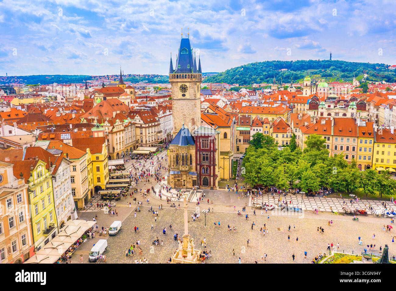 Drone view of Prague main square with historic buildings, church towers ...