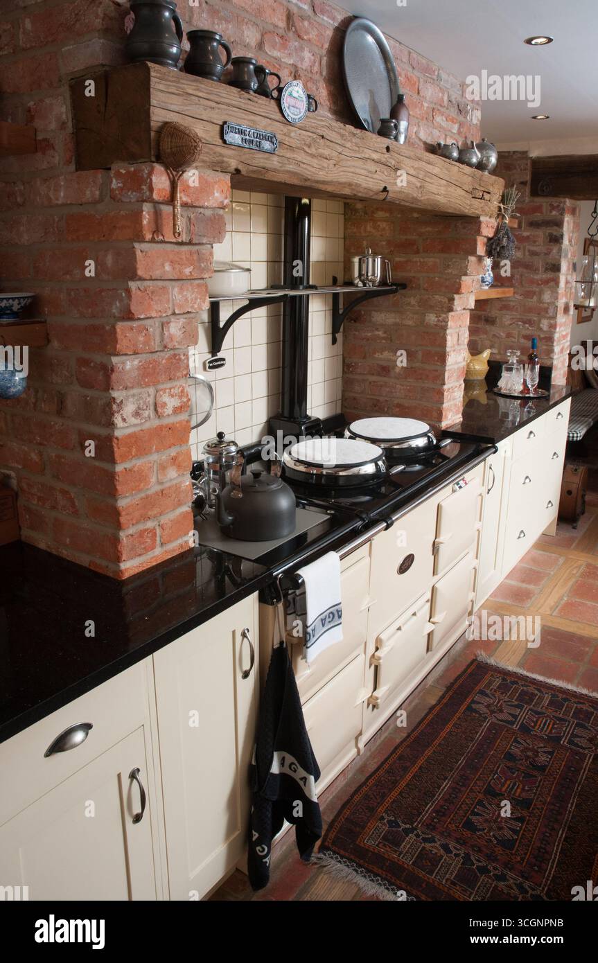 Bright and inviting kitchen features exposed brick walls, a sleek ...