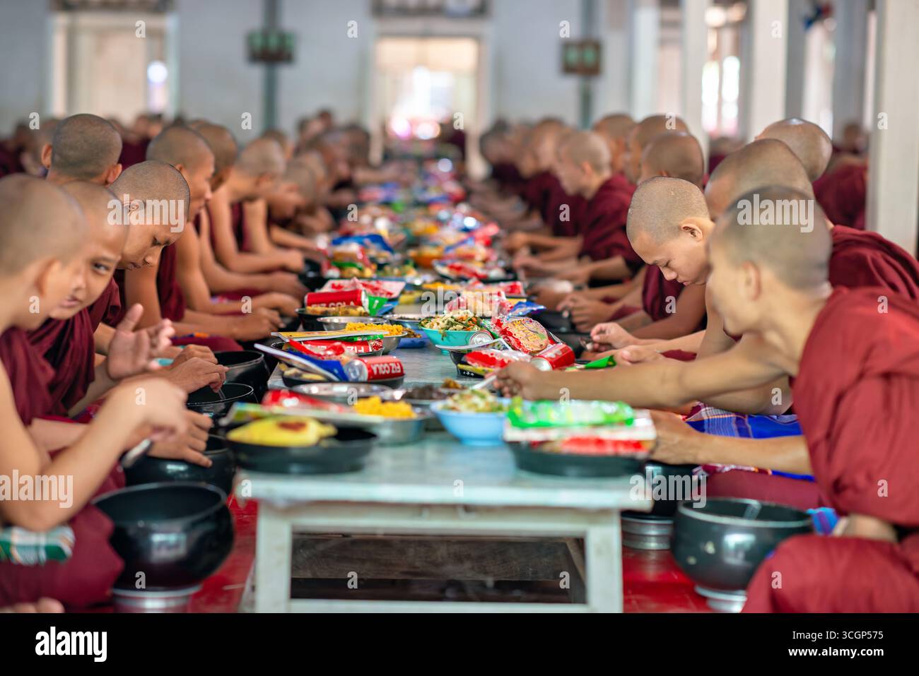 Novice monks eating hi-res stock photography and images - Alamy