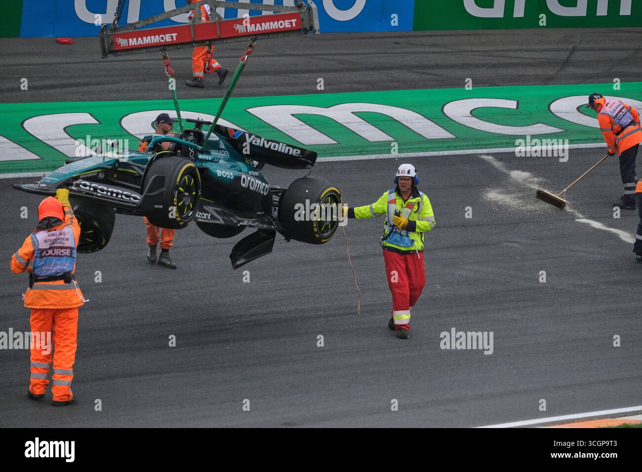 Race marshals remove the car of Aston Martin driver Lance Stroll of ...