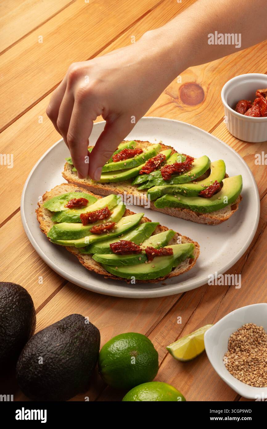 Hand serving sesame seeds hi-res stock photography and images - Alamy