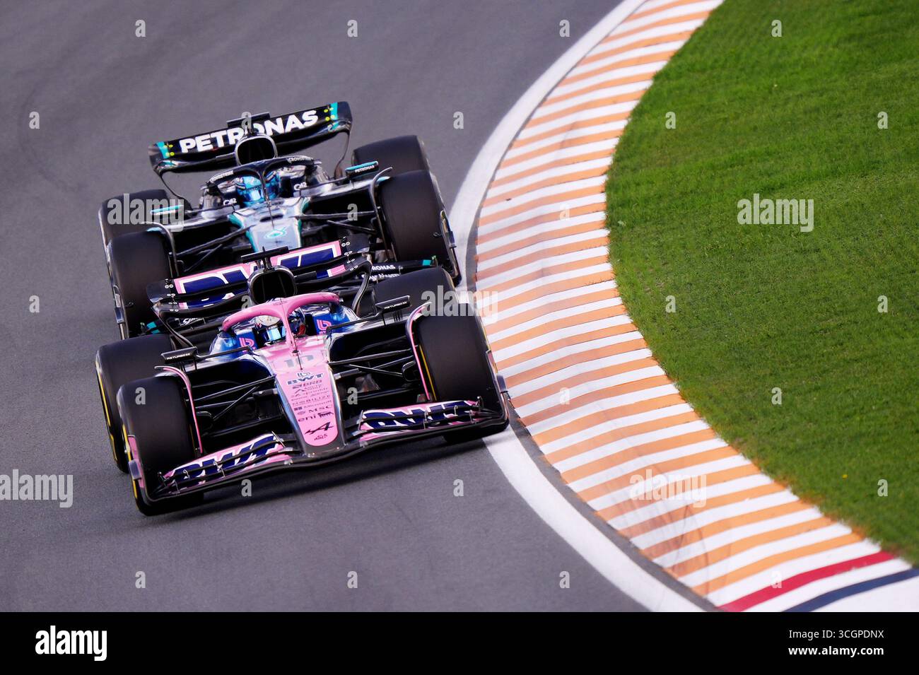 Alpine's Pierre Gasly and Mercedes' George Russell (top) during 2nd ...