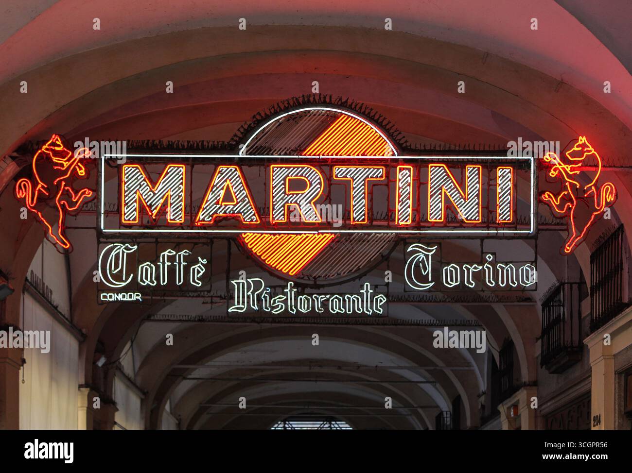 In the heart of Turin: the neon Martini of Café Torino Stock Photo - Alamy