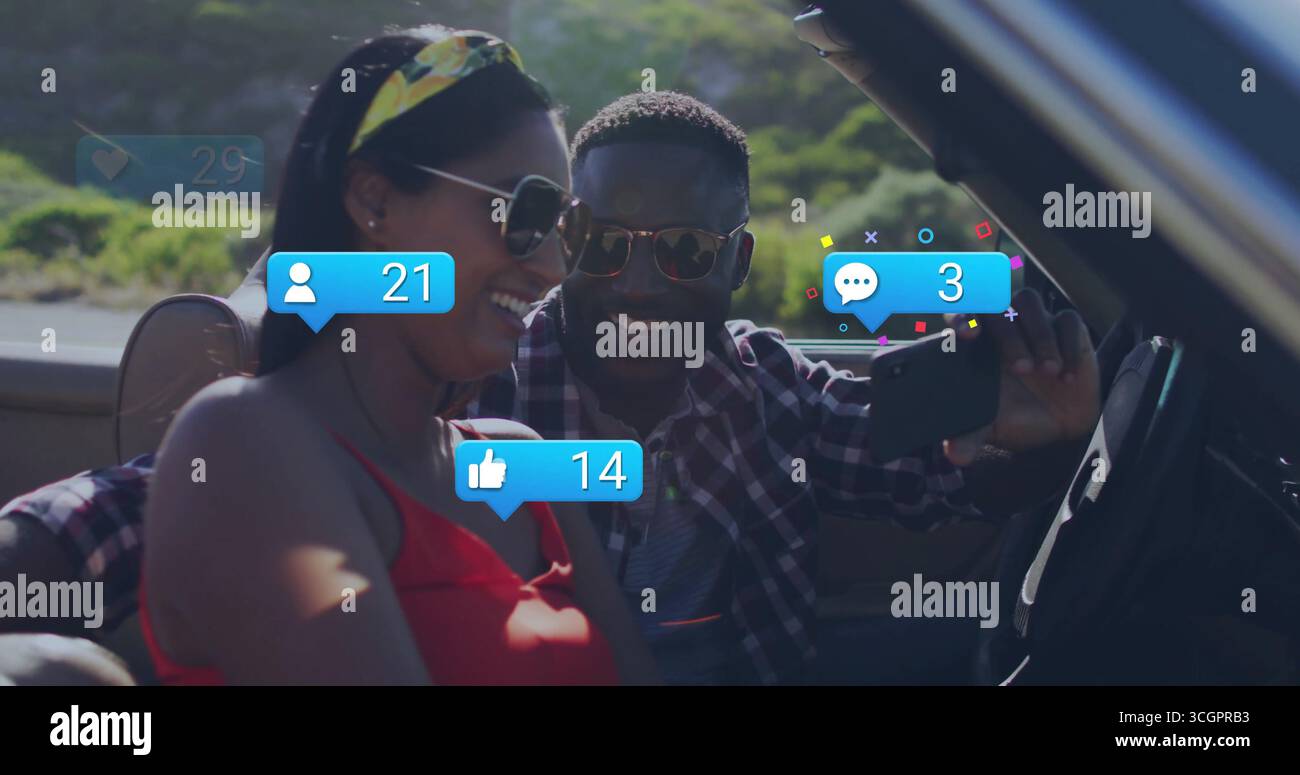 Taking selfie sunglasses-clad couple in convertible on scenic road ...