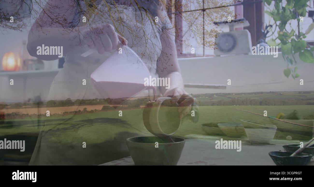 Female potter pouring clay slip hi-res stock photography and images - Alamy