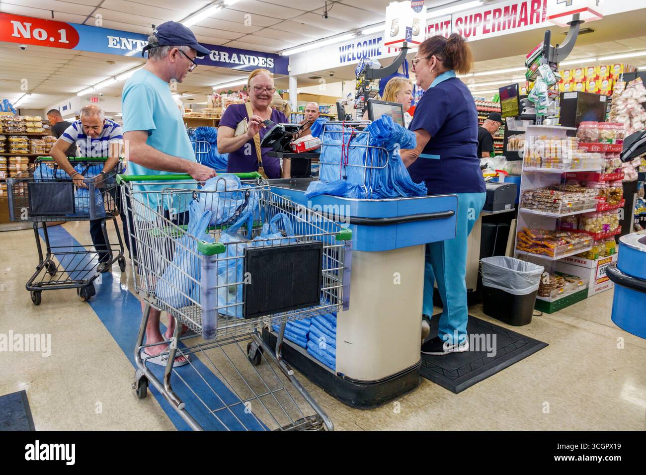 Man woman cashier checkout register point of sale transaction shopping ...