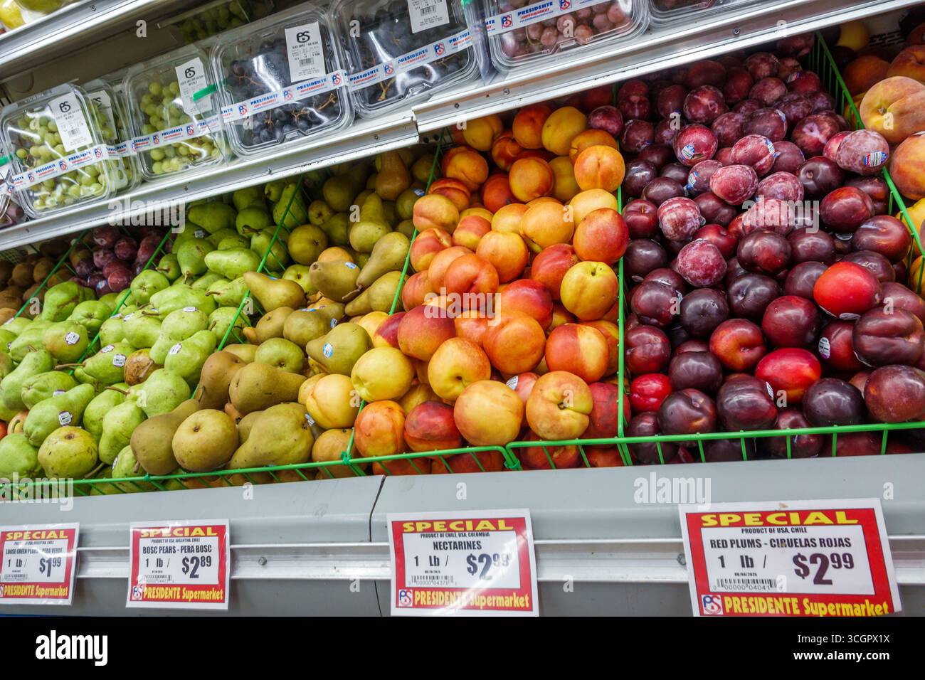Supermarket refrigeration crates filled with assorted fruits hi-res ...
