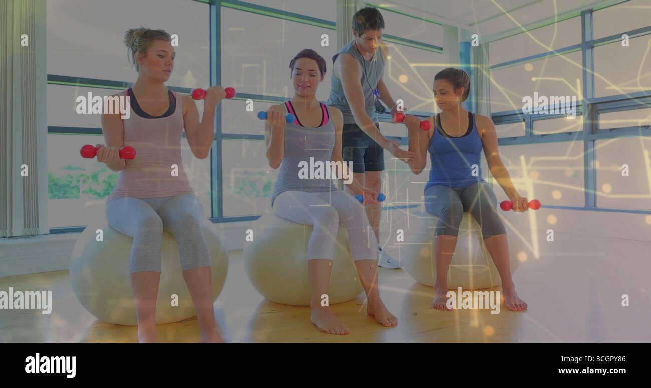 Exercising dumbbells on stability balls hi-res stock photography and ...