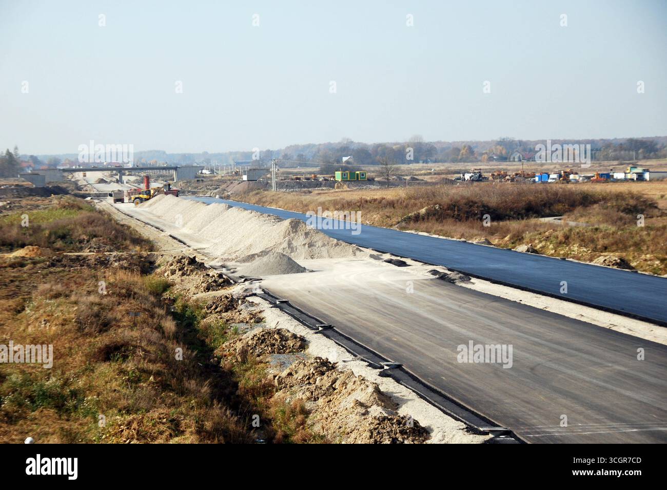 Highway A4 construction – heavy machinery and asphalt base Stock Photo ...