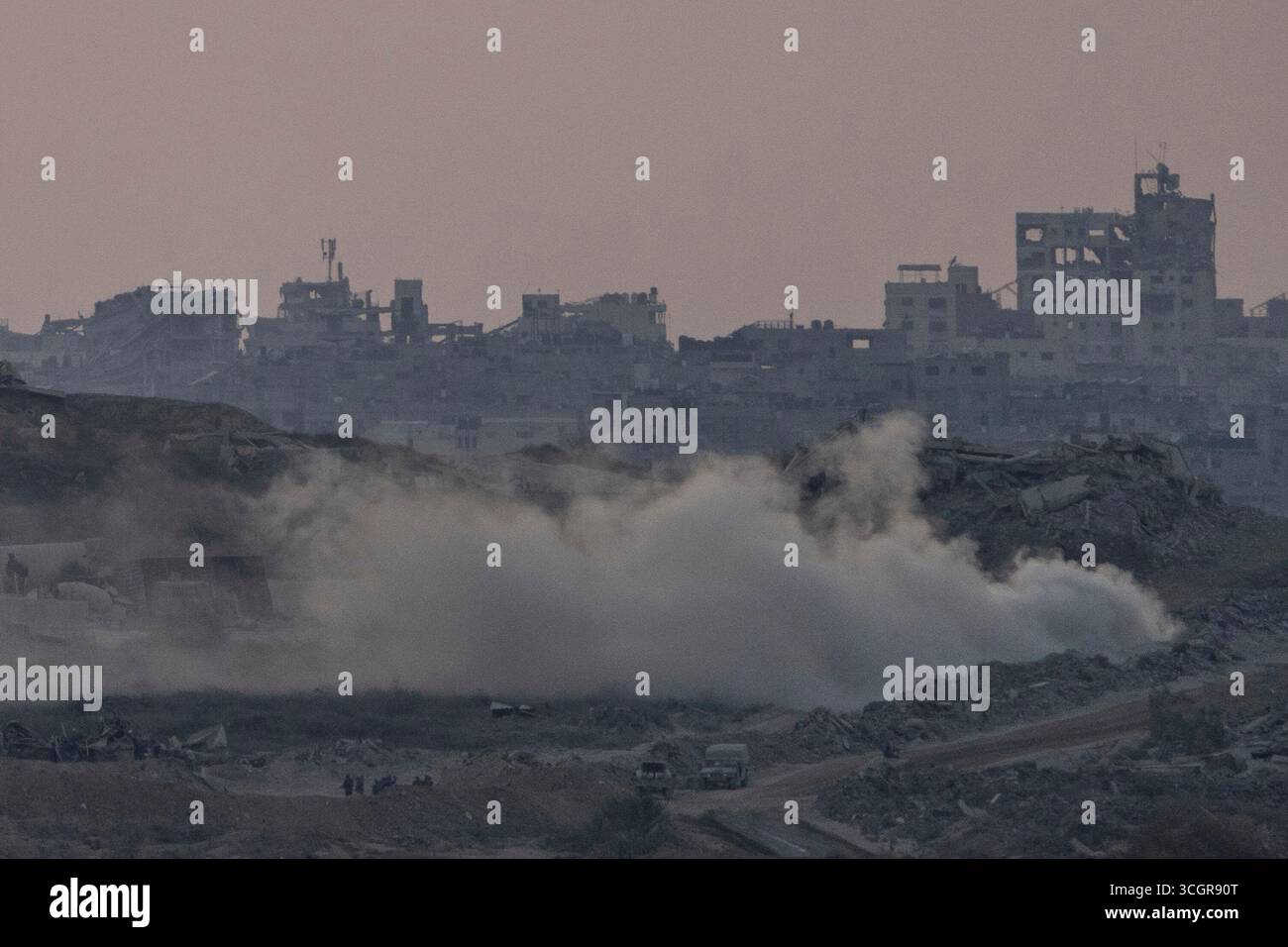 Israeli soldiers stand in an area of the Gaza Strip, as seen from ...