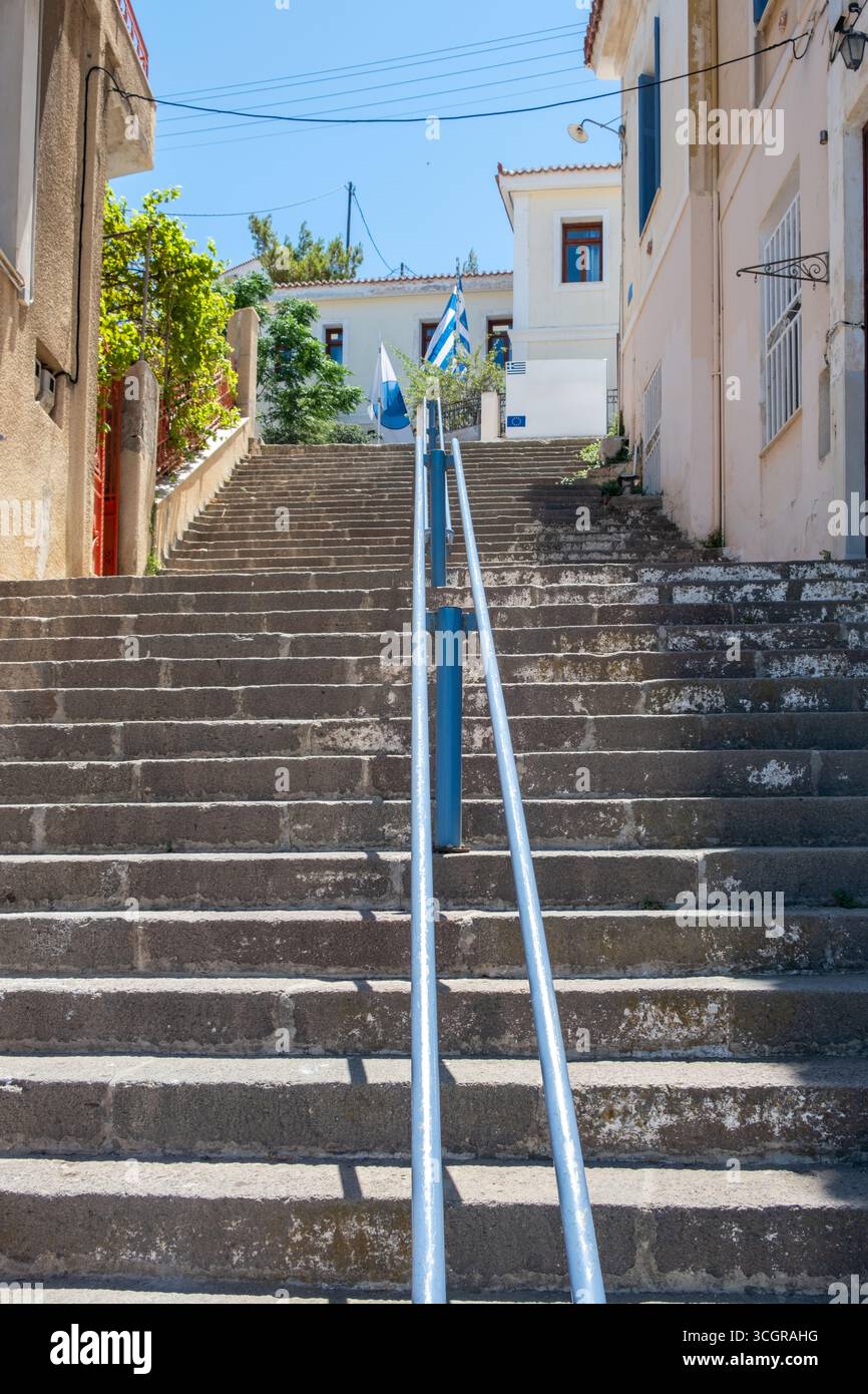 Wide stone stairway with blue railings leading upward between old ...