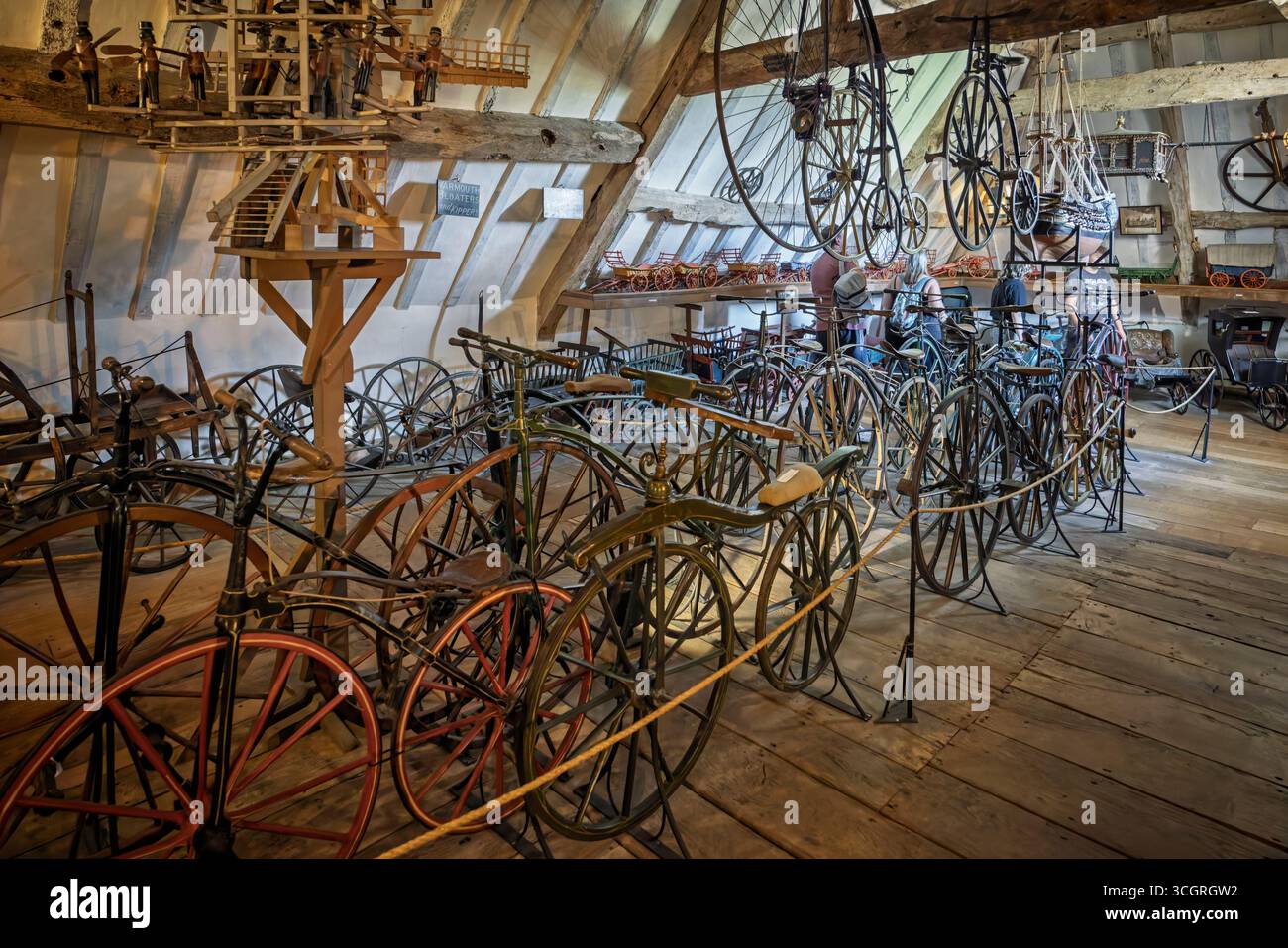 Collection of vintage bicycles on display inside Snowshill Manor ...