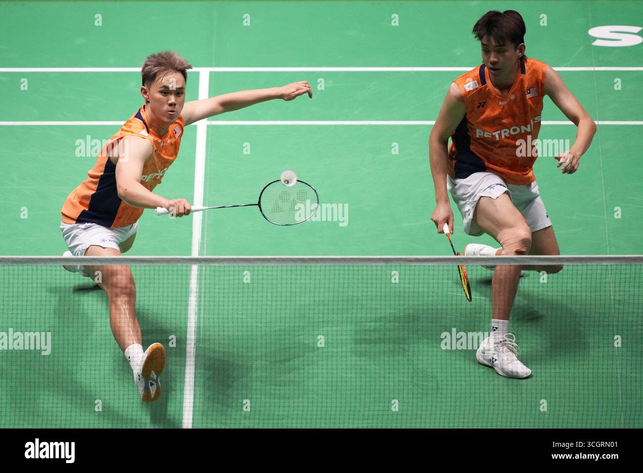 Kai Wun Tee, left, and Man Wei Ching, of Malaysia play Kim Won Ho and Seo Seung Jae, of South ...