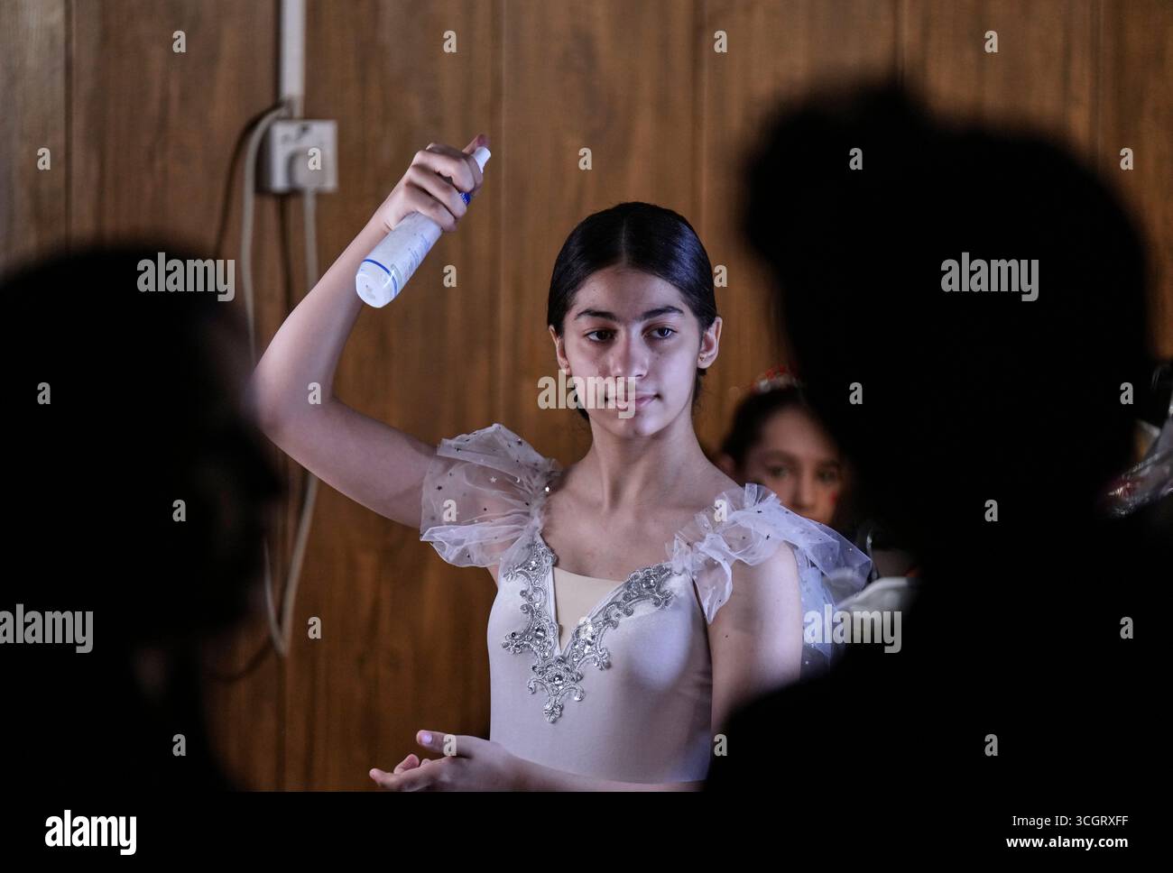 A Baghdad Ballet Academy student prepares to perform "Alice in ...