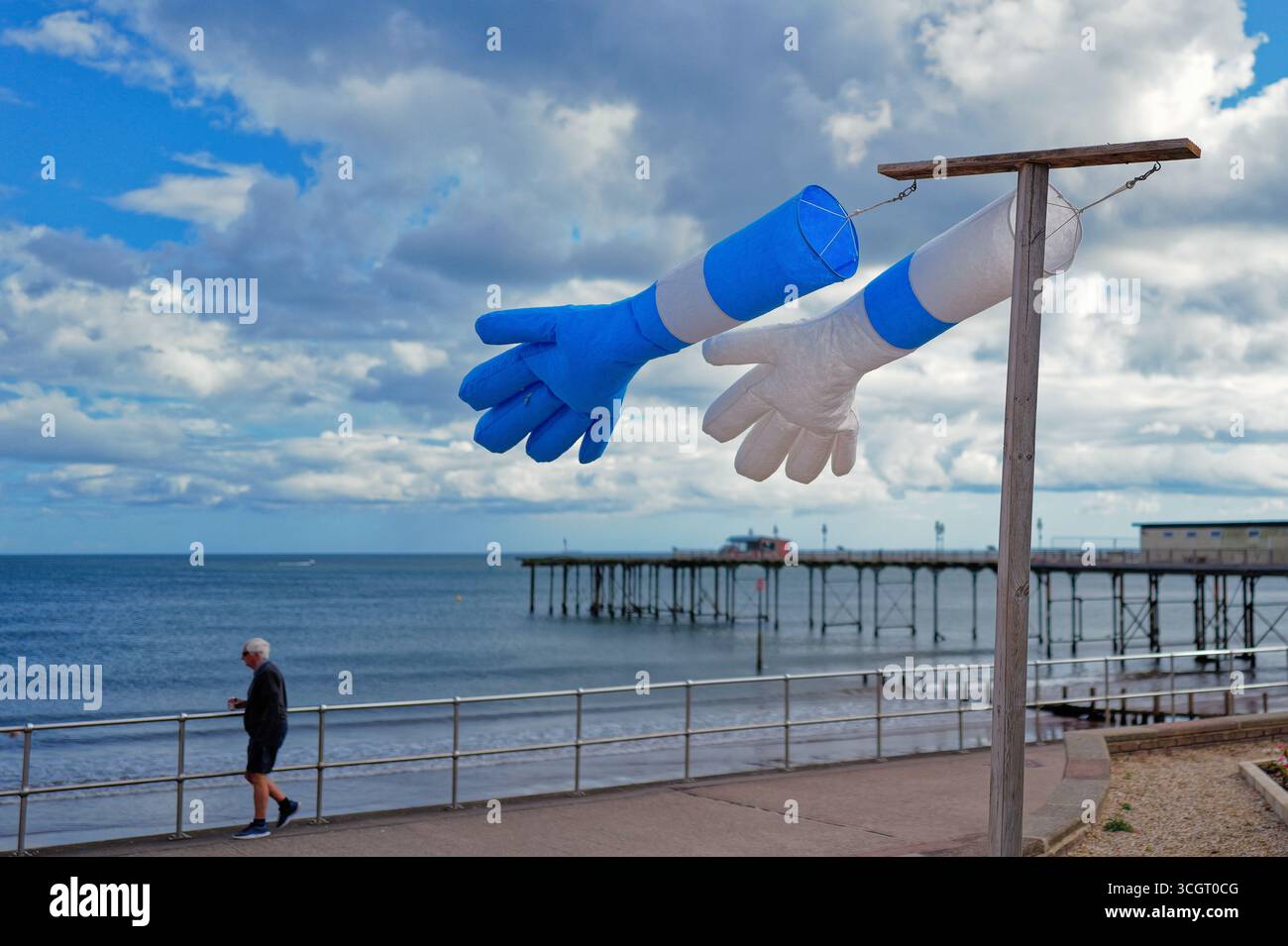 Man made art installation of large gloves hi-res stock photography and ...