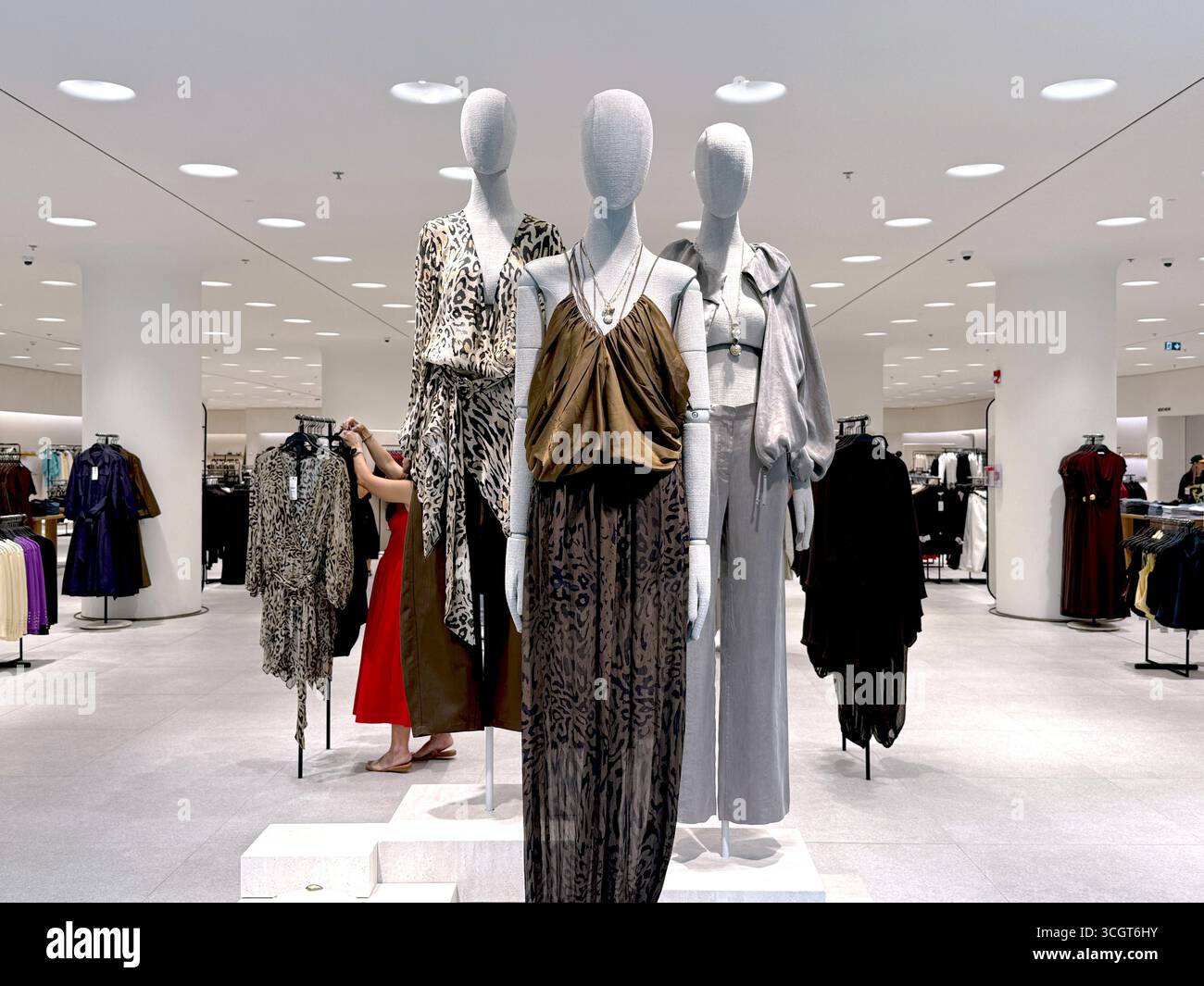 Modern interior of fashion store with mannequins in stylish women's ...