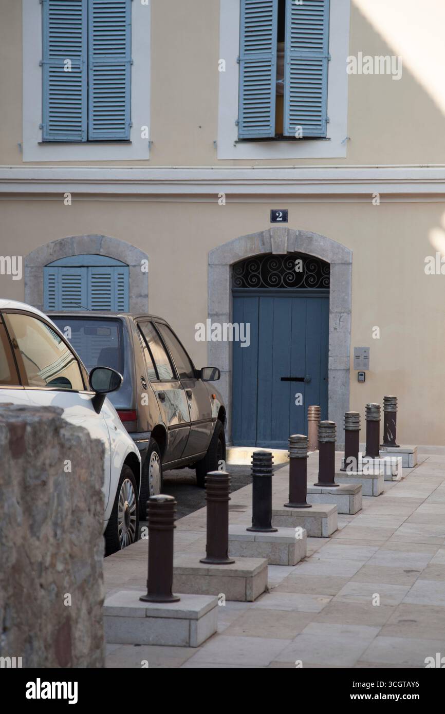 Classic and typical French street with bollards Stock Photo - Alamy