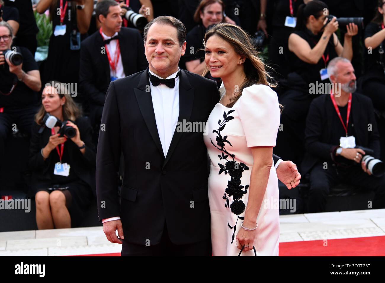 29 August 2025, Italy, Venedig: Michael Stuhlbarg, actor in the film, and his wife Mai-Linh ...
