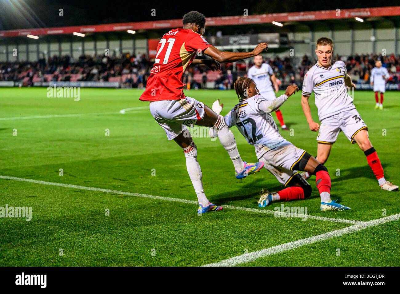 Kallum Cesay of Salford City FC under pressure from Freddy Willcox and ...