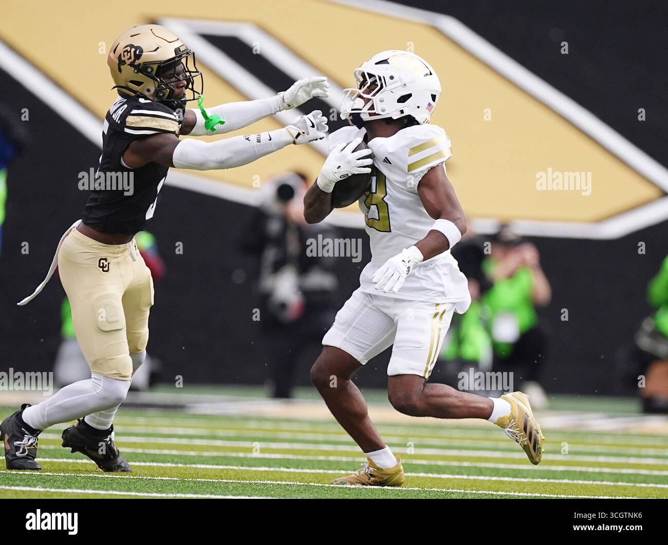 Colorado cornerback RJ Johnson, left, reaches out to stop Georgia Tech ...