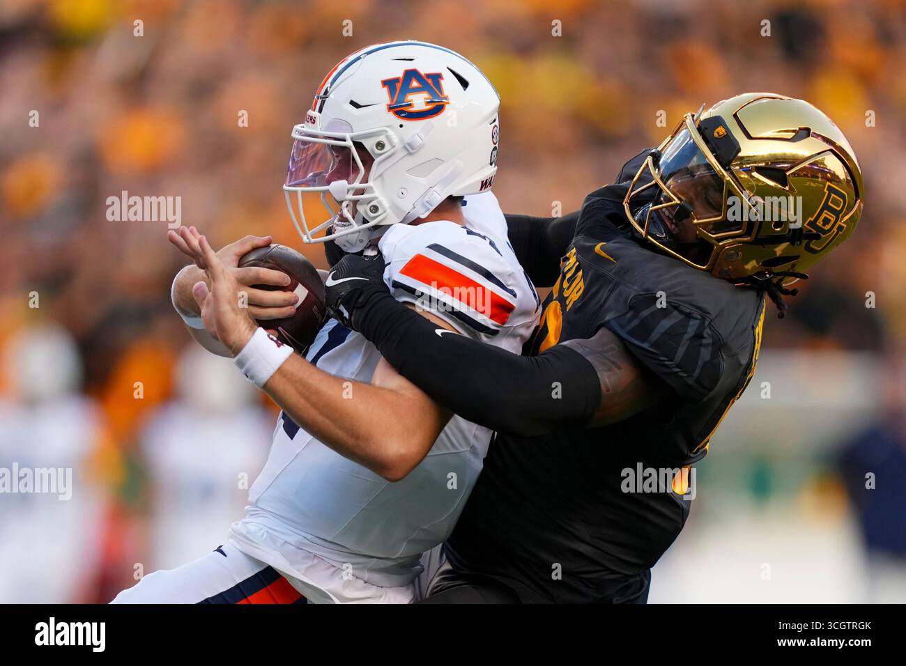Baylor linebacker Matthew Fobbs-White, right, stops Auburn quarterback ...