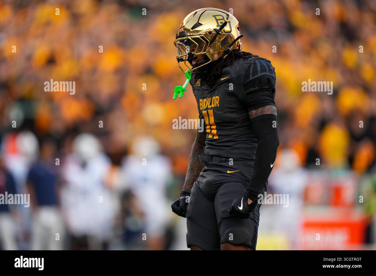 Baylor linebacker Keaton Thomas reacts after making a stop on a play by ...