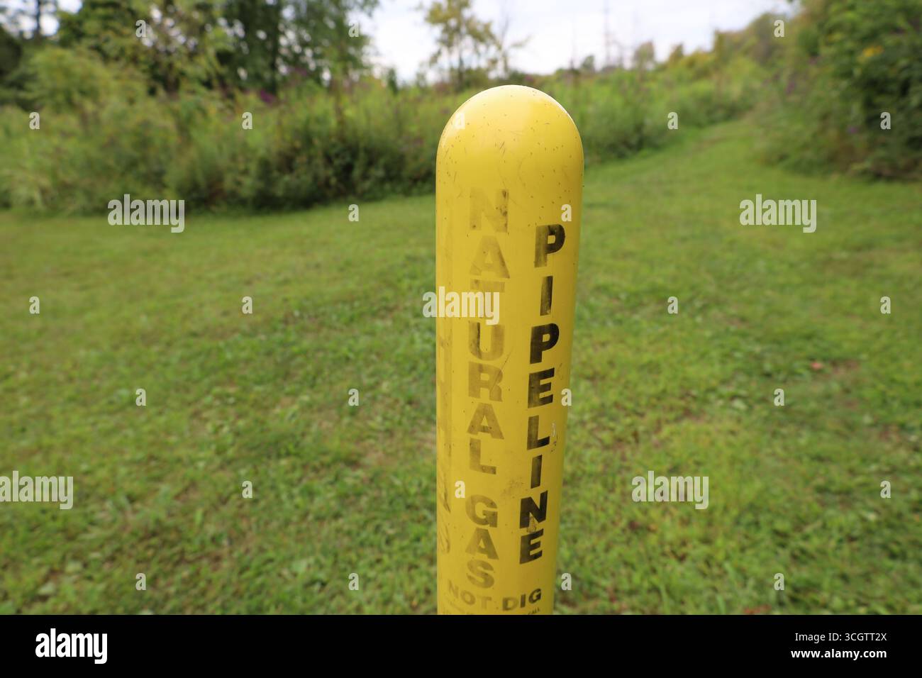 Natural gas pipeline warning post in nature area Stock Photo - Alamy