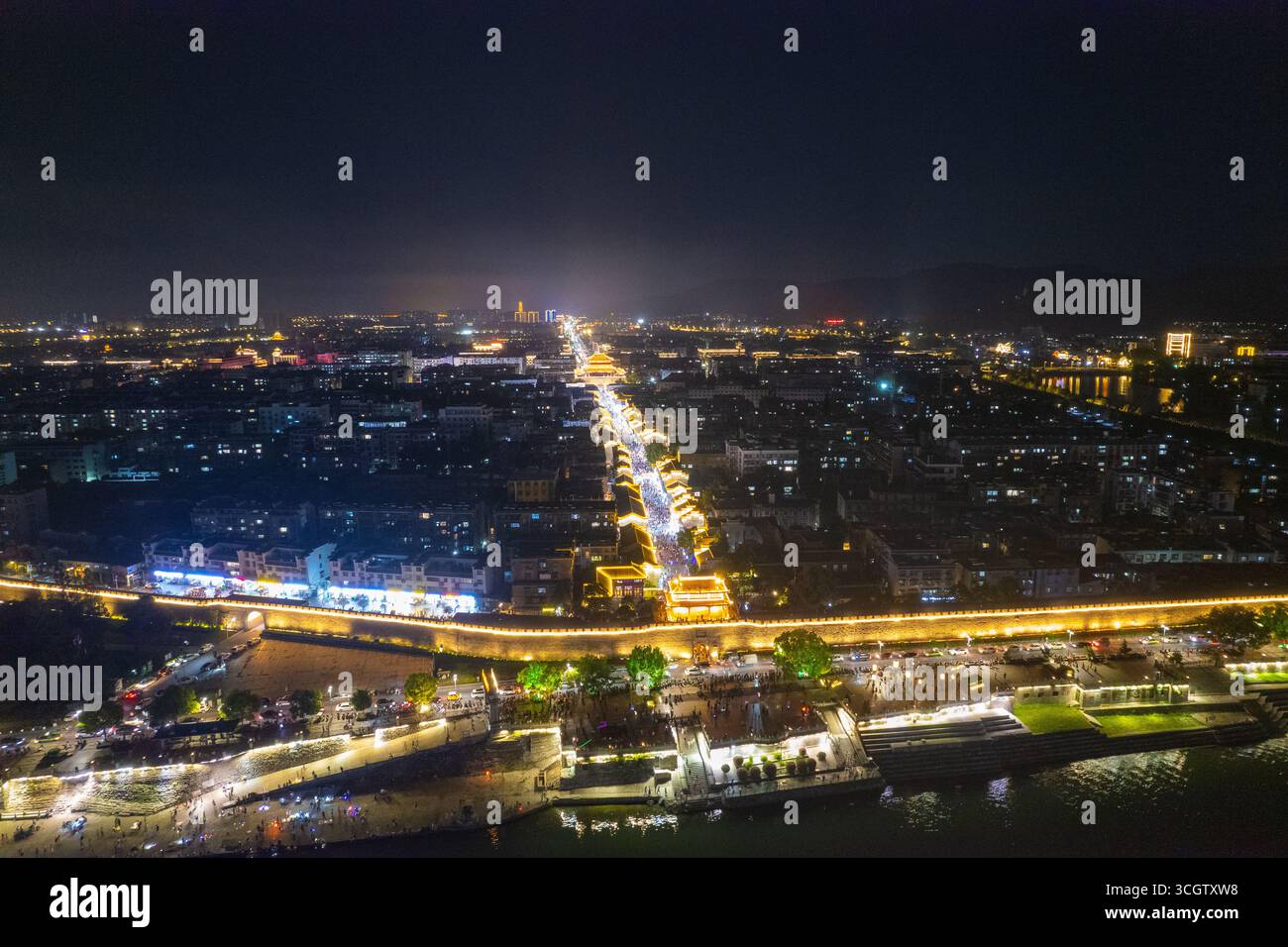 Vibrant Chinese city panorama at night showcases illuminated ancient ...