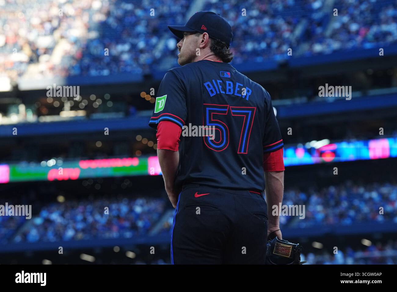 Toronto Blue Jays pitcher Shane Bieber (57) steps onto the field before ...