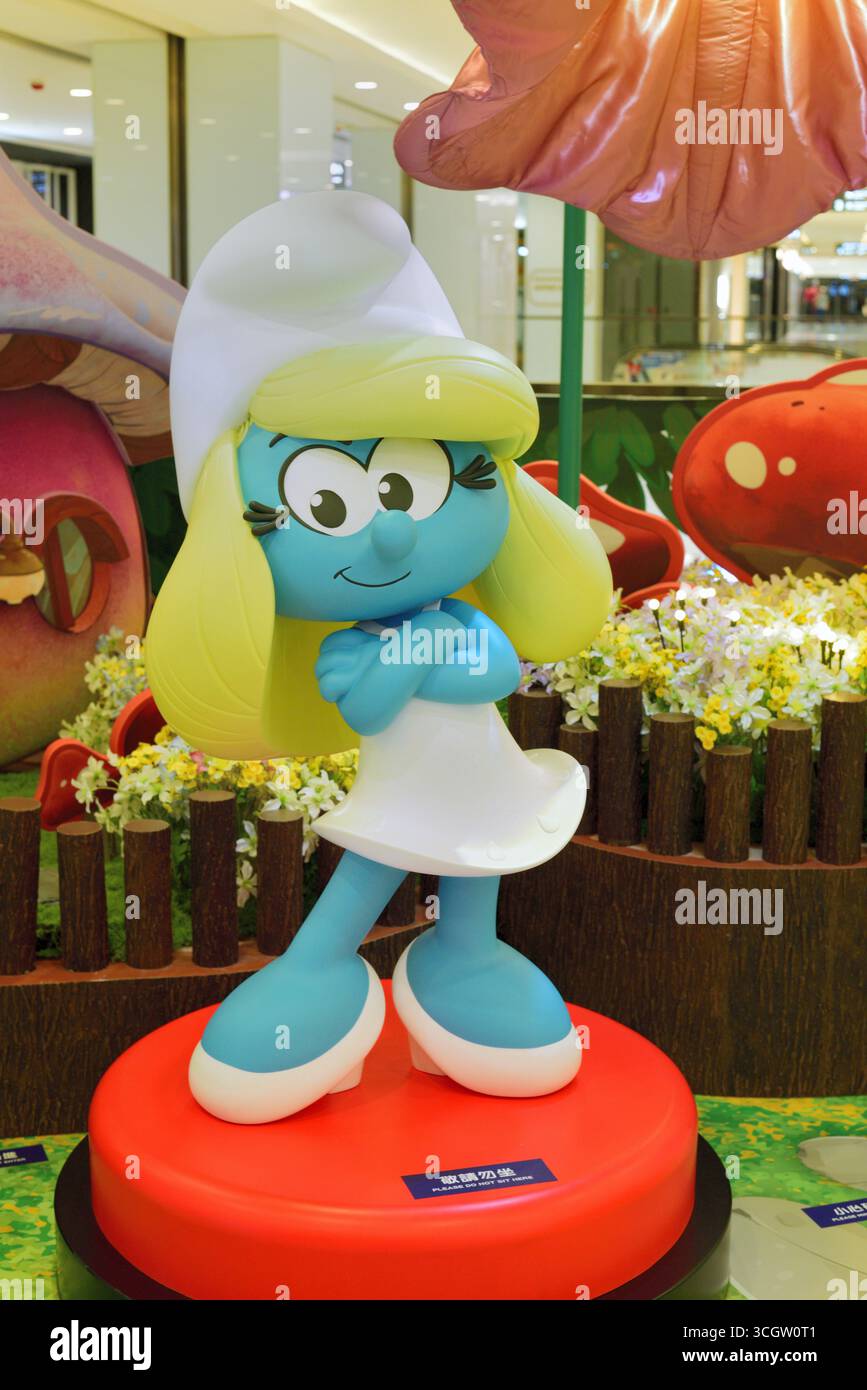 Crossed arms smurfette Stock Photo - Alamy