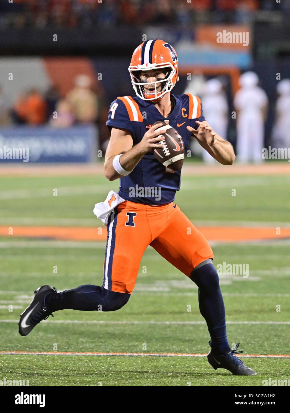 CHAMPAIGN, IL - AUG 29: Illinois quarterback Luke Altmeyer (9) rolls ...