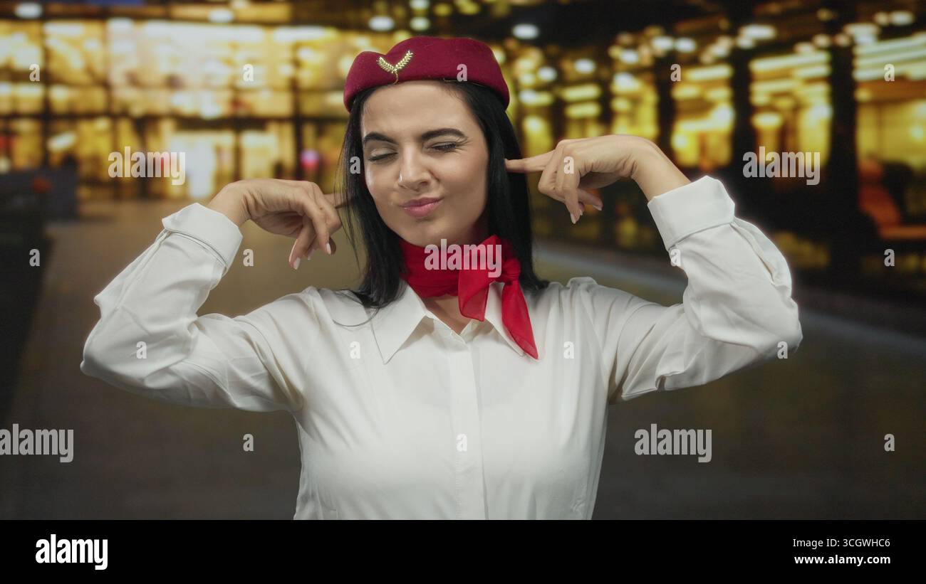 Flight attendant covering ears hi-res stock photography and images - Alamy