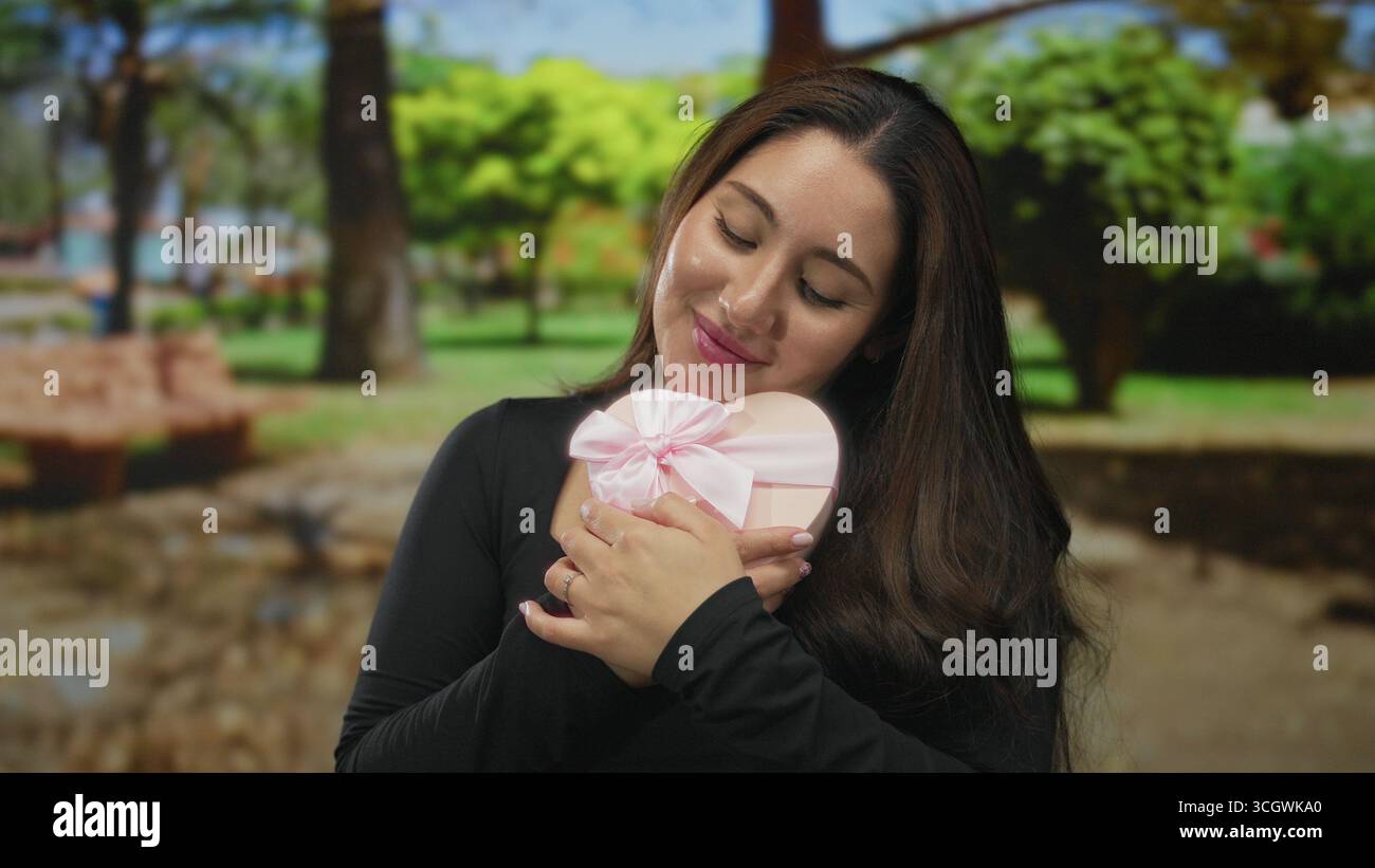 Woman hugs box against chest hi-res stock photography and images - Alamy